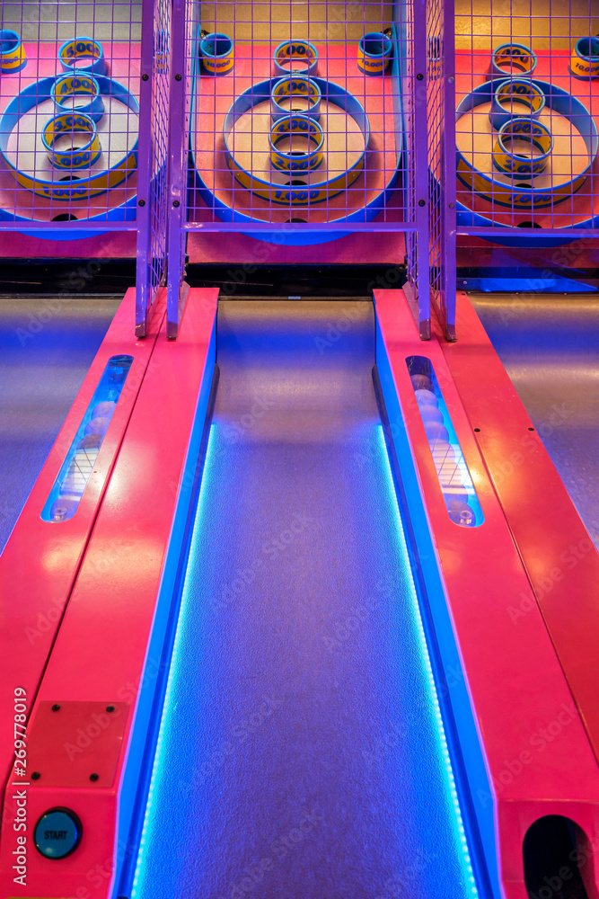 roll a ball up a ramp into a hole Stock Photo | Adobe Stock