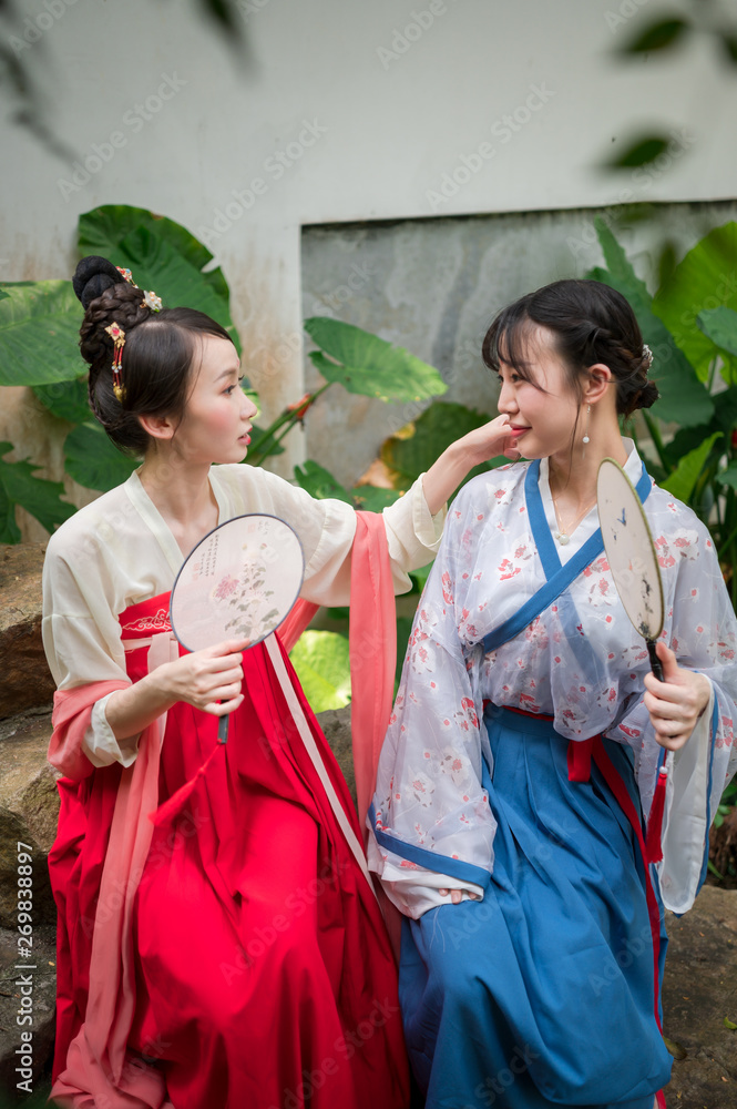 Two young women wearing in Chinese Han clothing in traditional Chinese ...