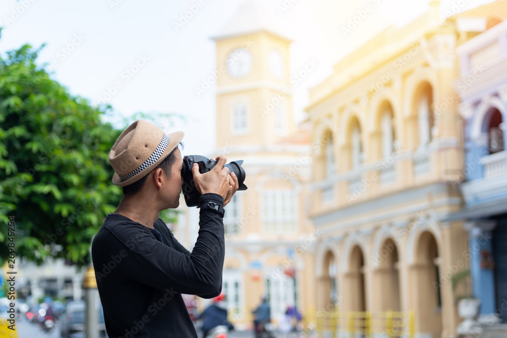Tourist sightseeing old town ,traveling concept..Asian man holding ...