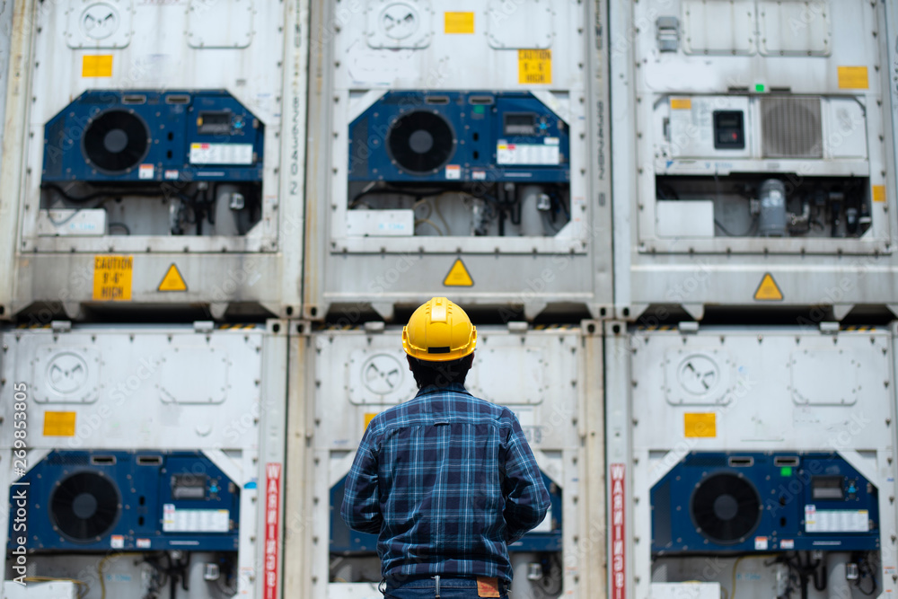 Reefer technician is taking care of reefer container at the port while ...