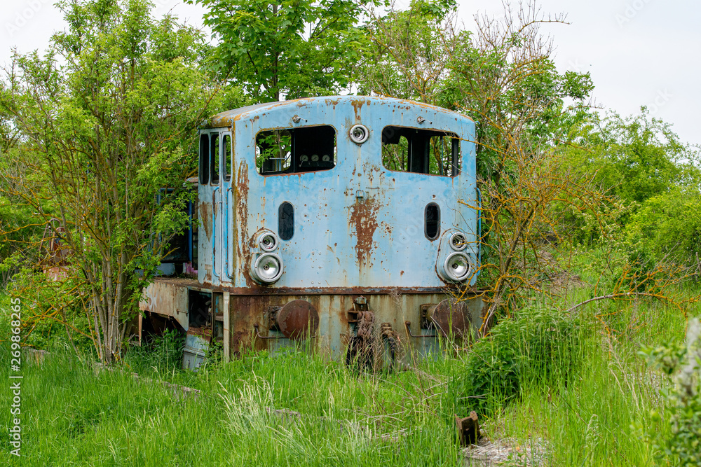 The charm of an old train journeying through the countryside captures a ...