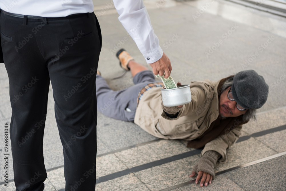 Man Giving Money To Homeless