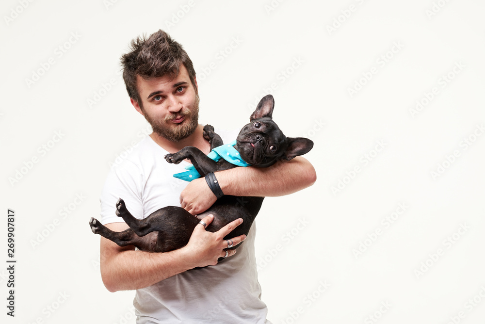 Hipster Bearded guy holding and hugging a nice French Bulldog dog in ...