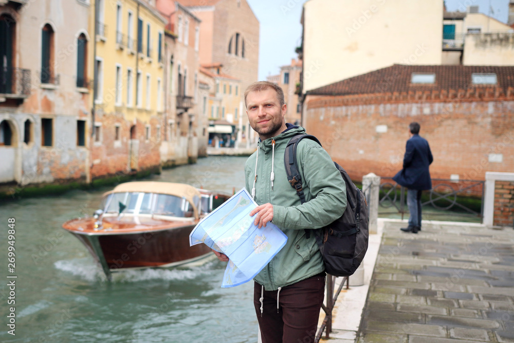 Tourist in Venice, Italy. Man with city map in venetian street. Young ...