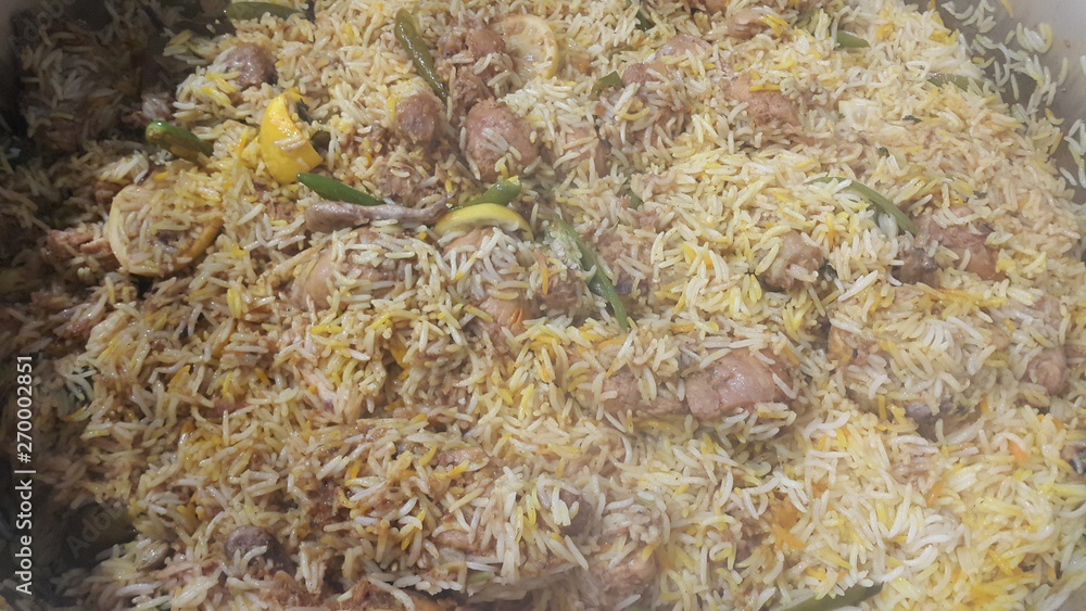 A close up view of cooked rice chicken biryani made with traditional ...