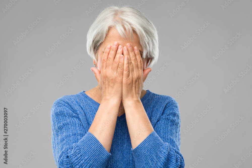 stress, emotions and old people concept - sad senior woman covering her ...