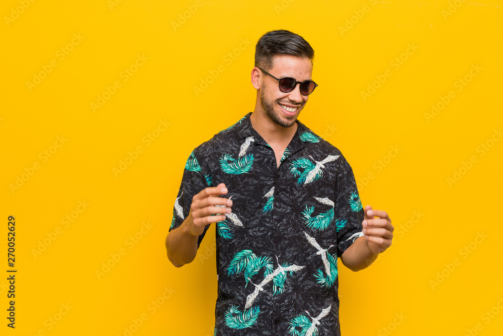Young filipino man wearing summer clothes joyful laughing a lot ...
