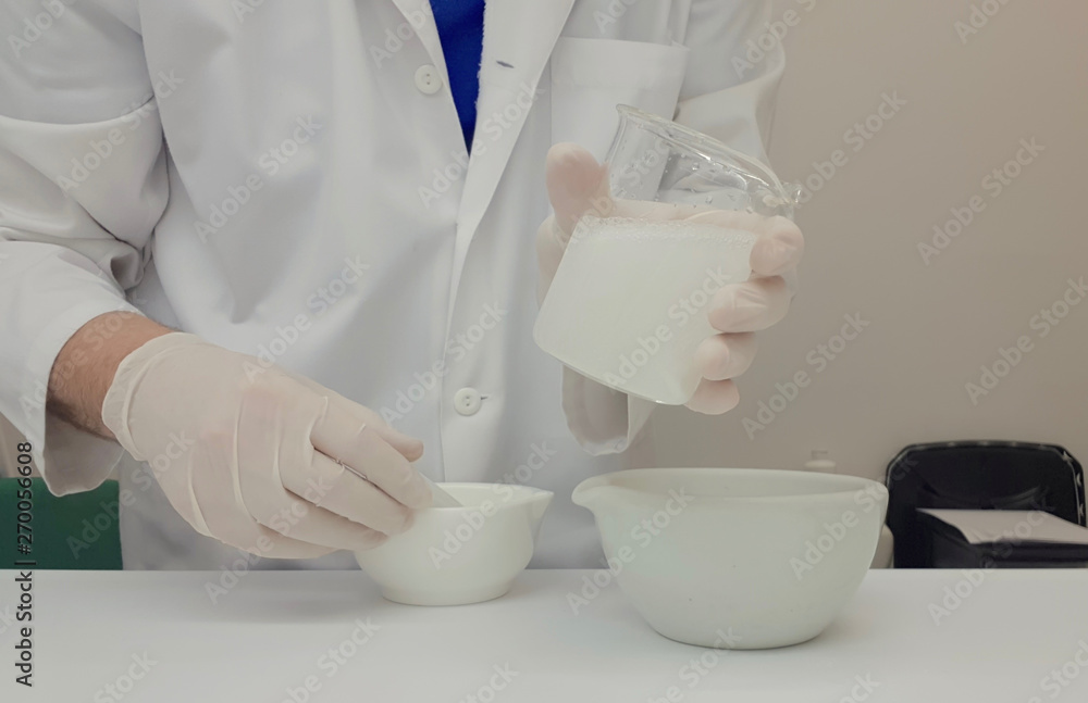 Pharmacist performing a quality control of effervescent tablets Stock ...