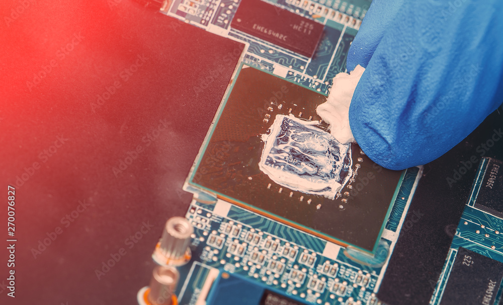 Application of thermal paste on the laptop processor chip for high ...