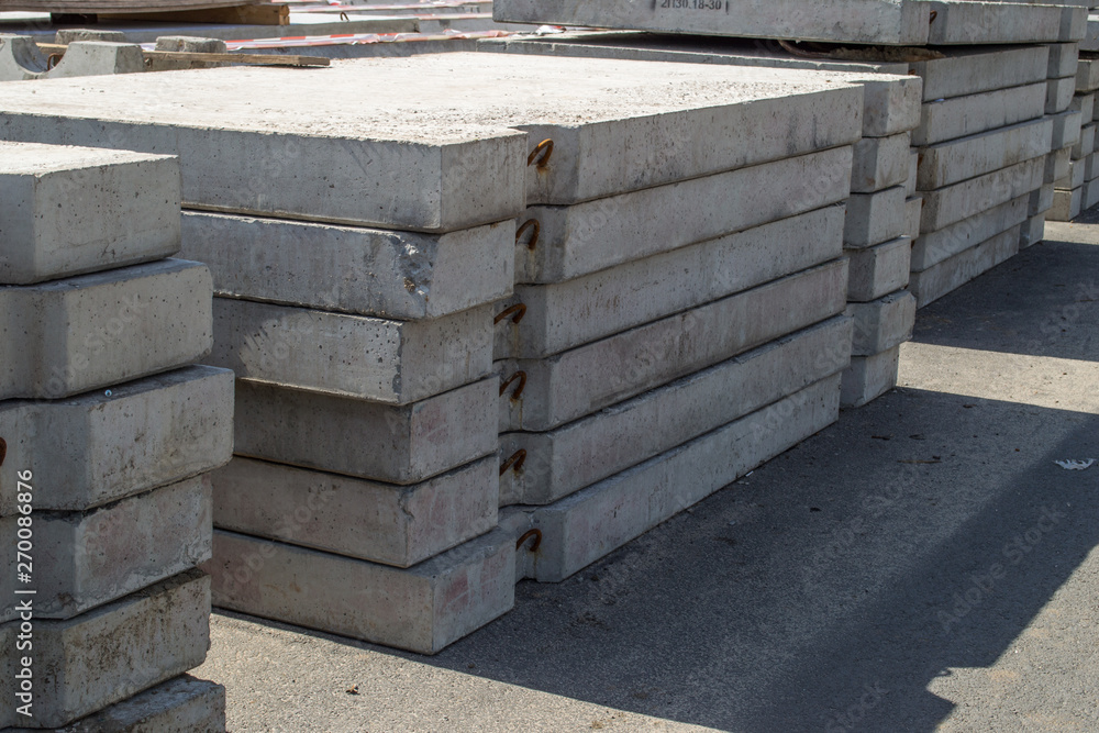 Stack of precast reinforced concrete slabs. Construction site or plant ...