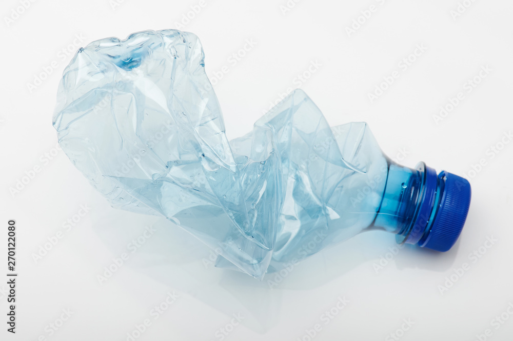 Crashed blue plastic bottle Stock Photo | Adobe Stock