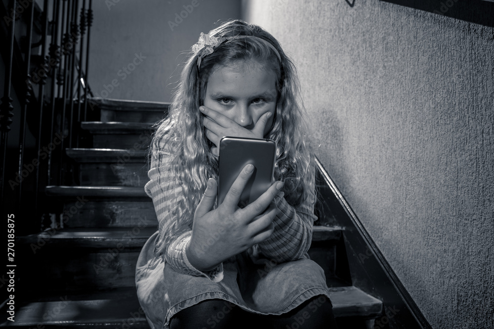 Sad depressed unhappy child suffering from cyberbullying by mobile ...