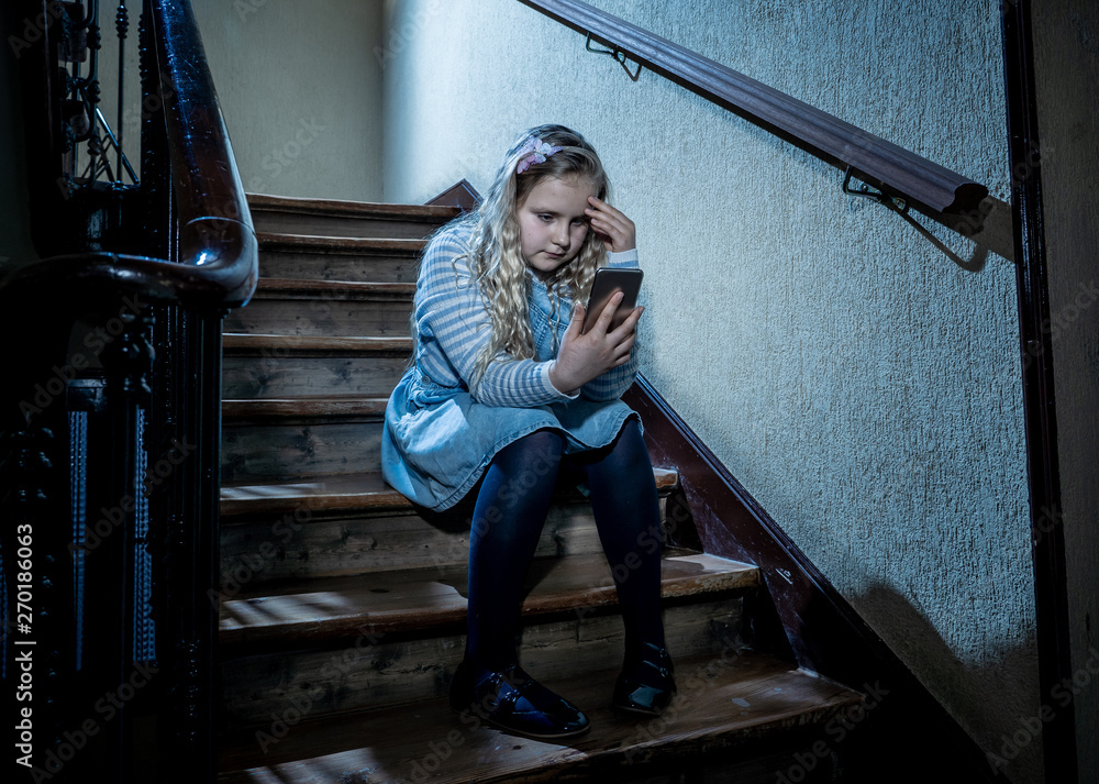 Sad depressed unhappy child suffering from cyberbullying by mobile ...