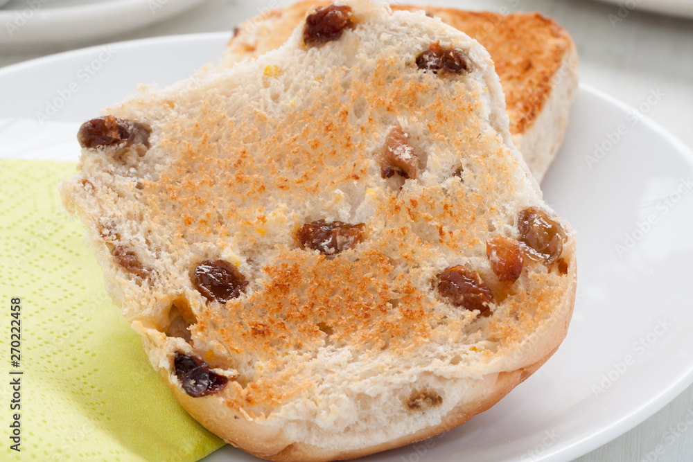 Hot teacakes a traditional British sweet bun filled with raisins and a ...
