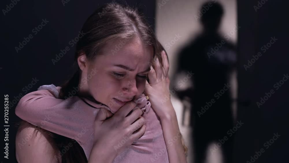 Defenseless woman hugging child, drunkard male with bottle entering ...