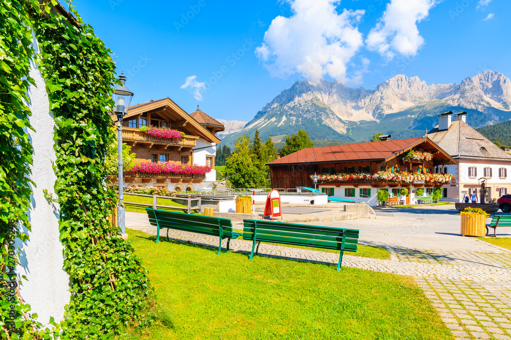 Traditional alpine houses on square in village of Going am Wilden ...