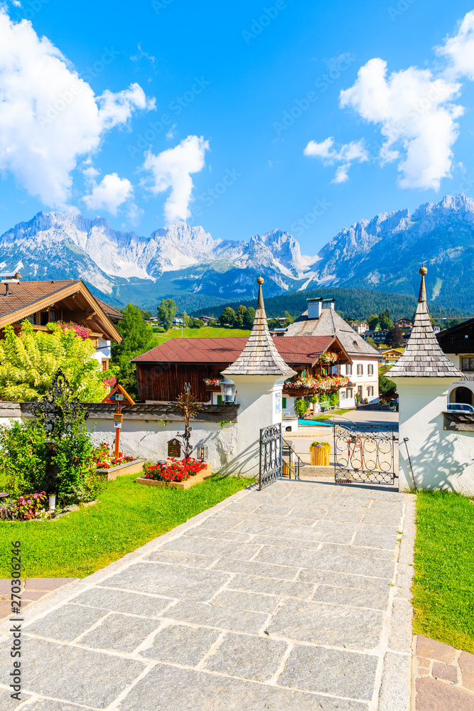 TIROL, AUSTRIA - JUL 30, 2018: Church cemetery and traditional alpine ...