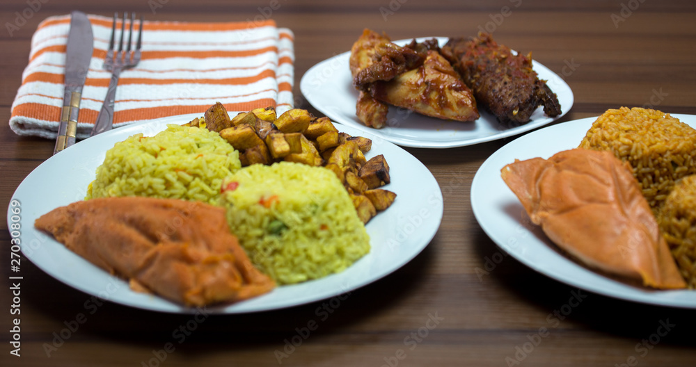 fried rice, jollof rice and moi moi Stock Photo | Adobe Stock