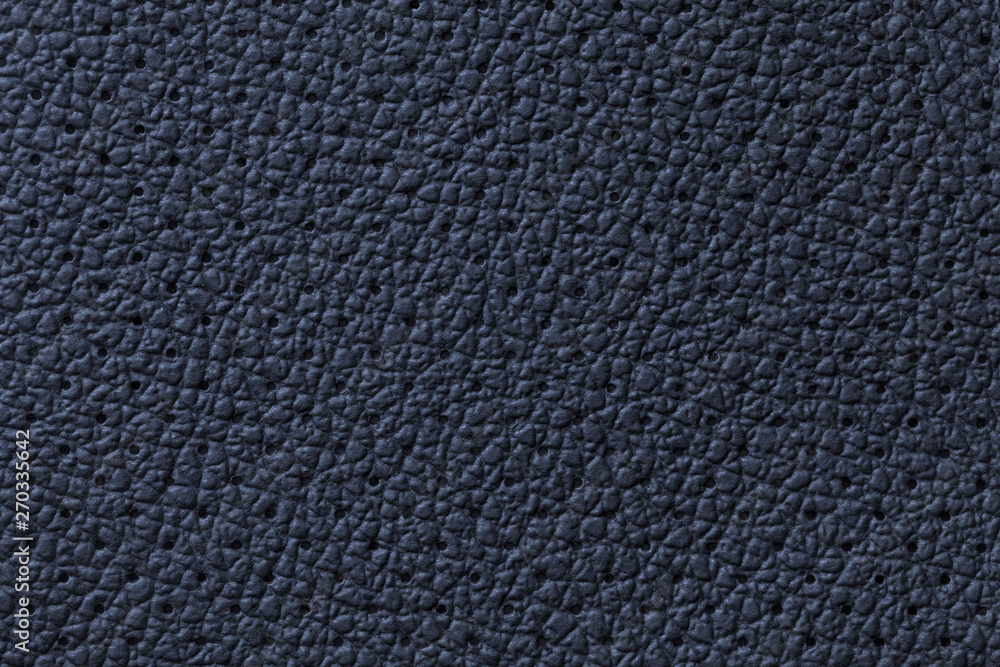Perforated navy blue leather texture background, closeup. Denim ...