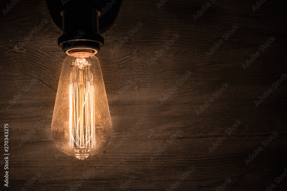 Edison vintage light bulb, retro light bulb in dark room and concrete ...