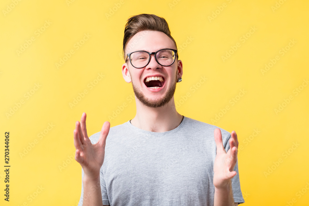 Fotka „Happiness excitement elation. Thrilled young man describing ...