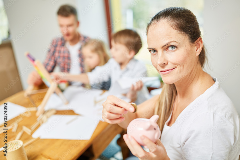 Frau mit Sparschwein als Symbol für Sparsamkeit Stock Photo | Adobe Stock