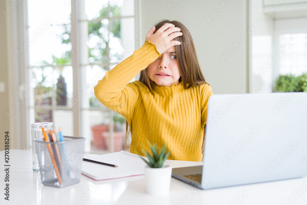 Beautiful young girl studying for school using computer laptop stressed ...