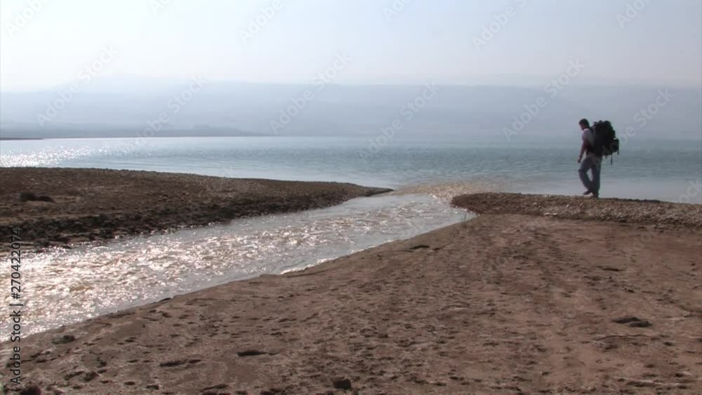 man close to Jordan river Jordan River flows into the Dead Sea Israel ...