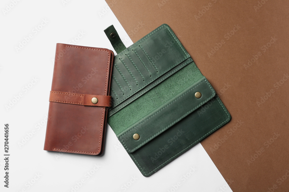 Stylish wallets on color background, top view Stock Photo | Adobe Stock