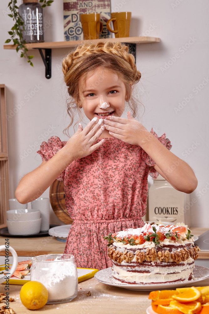 Little girl is making a homemade cake with an easy recipe at kitchen ...