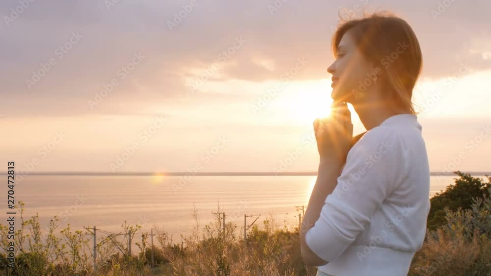 face profile of young beautiful woman turning to God in nature at ...