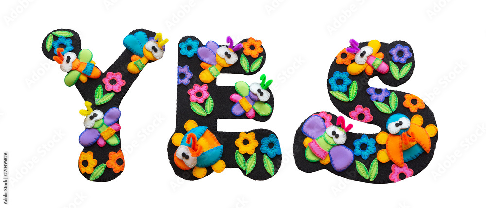 YES word formed with letters made in black foamy decorated with toy ...