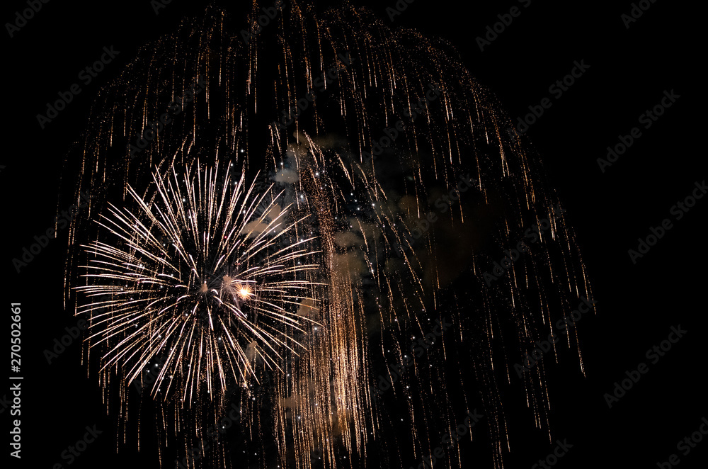 gold fireworks display exploding in black night sky Stock Photo | Adobe ...