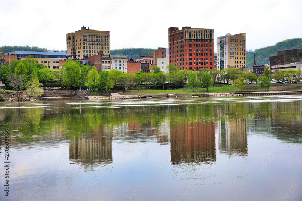 The skyline of Wheeling, West Virginia is reflected in the Ohio River ...