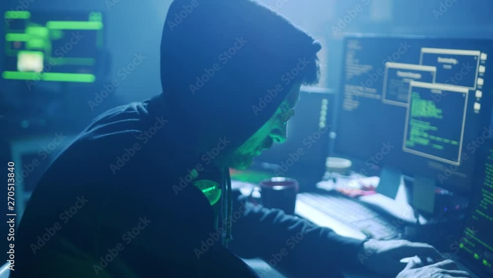 Profile of serious programmer coding technology working on computer in ...