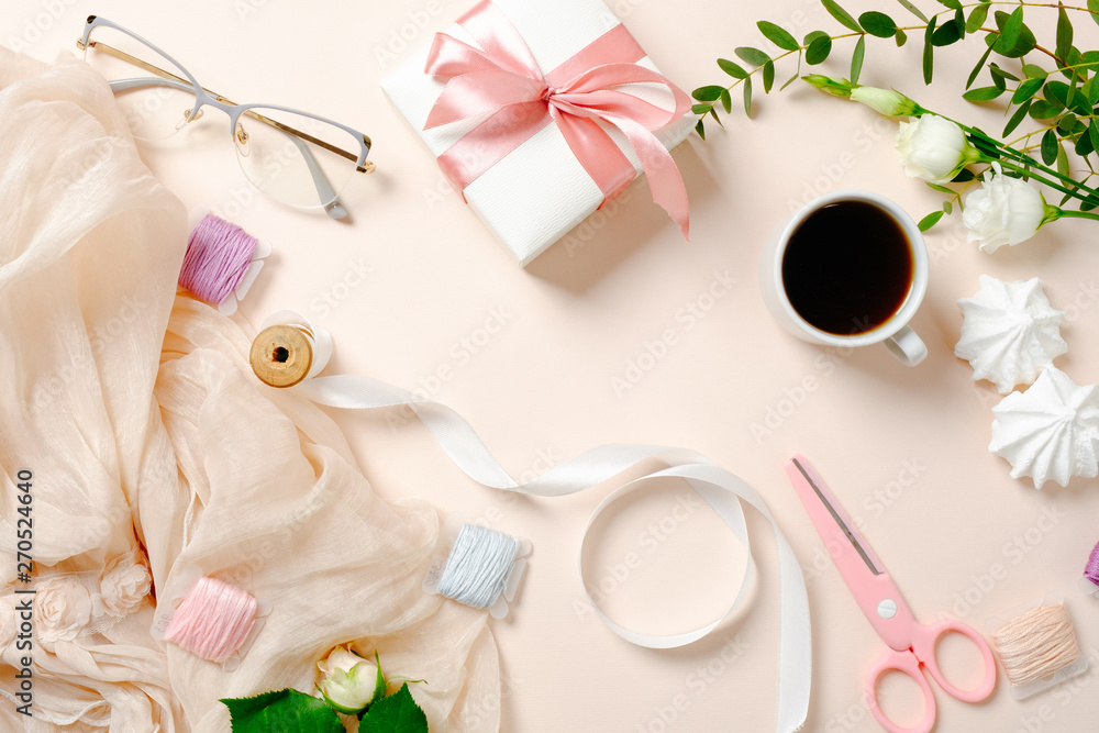 Flat lay, top view feminine desk with coffee cup, flowers, marshmallows ...