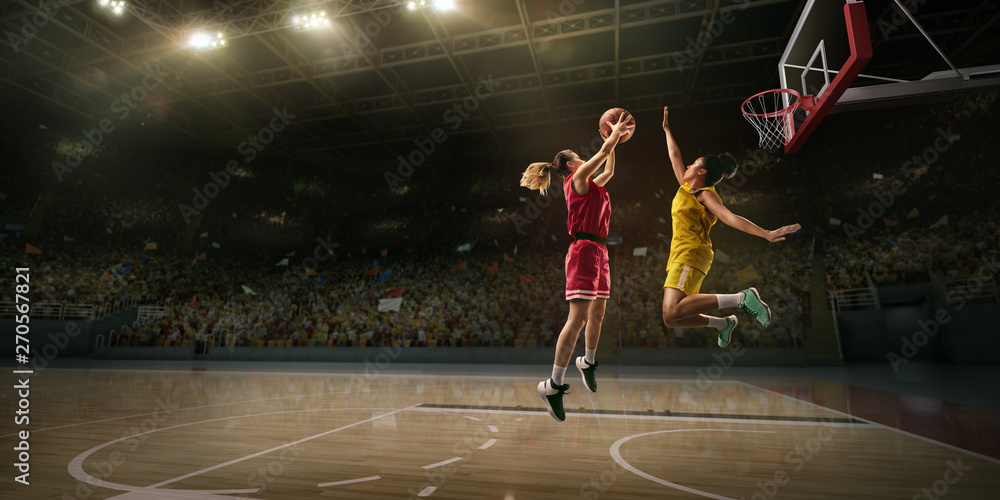 Female basketball players fight for the ball. Basketball player makes ...