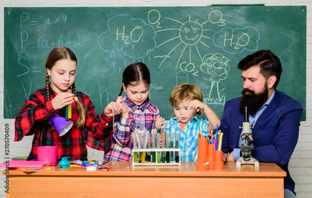 kids in lab coat learning chemistry in school laboratory. chemistry lab ...