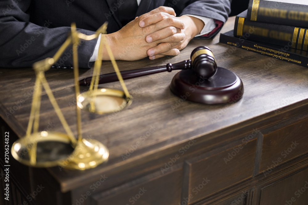 justice and law concept.Male judge in a courtroom working on wood table ...