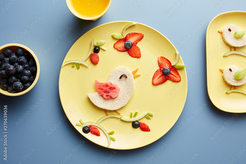 Pretty tasty bird made of bread with berries. Stock Photo | Adobe Stock