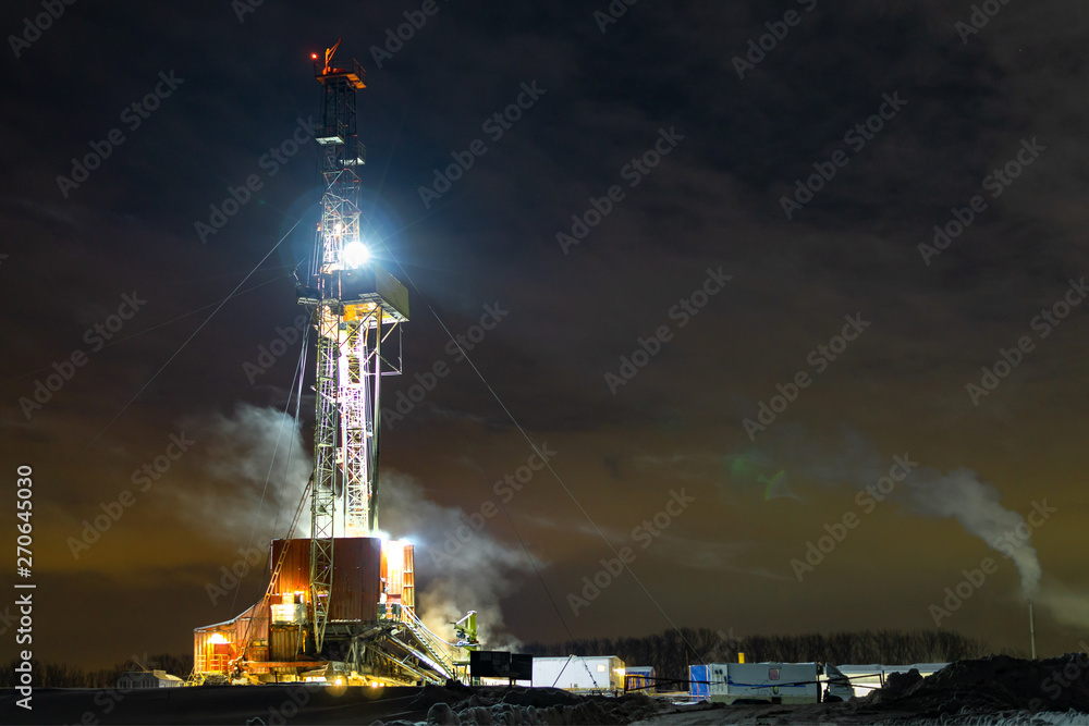 The beautiful sunrise landscape of Drilling rig in onshore oilfield of ...