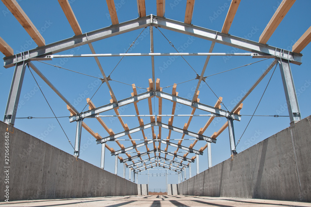 The metal frame of the building on a reinforced concrete base. The use ...