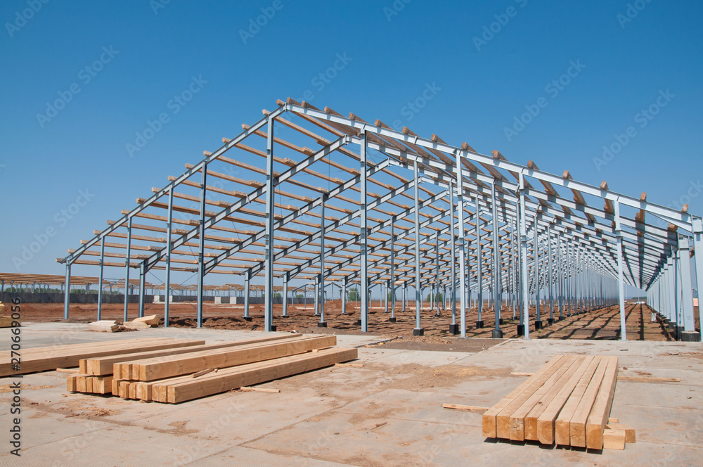 Wooden beams on steel structure for further construction. Metal frame ...