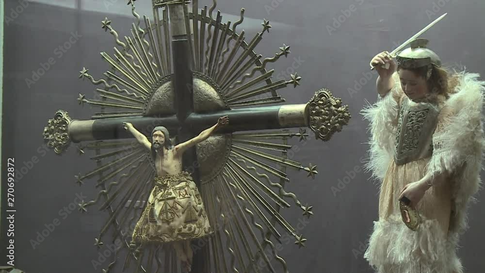 A close up shot of a sculpture of Jesus christ crucified on a cross and ...