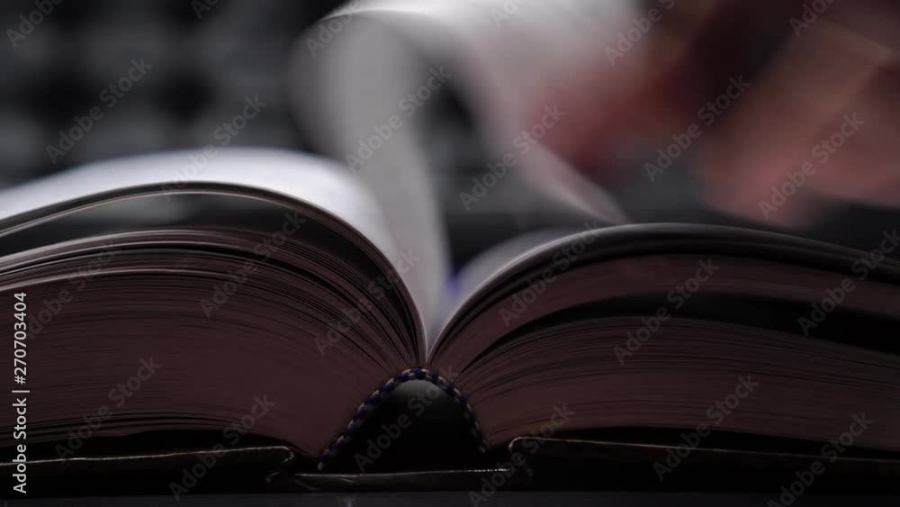 Reading old textbook in university library, read book or relaxing in ...