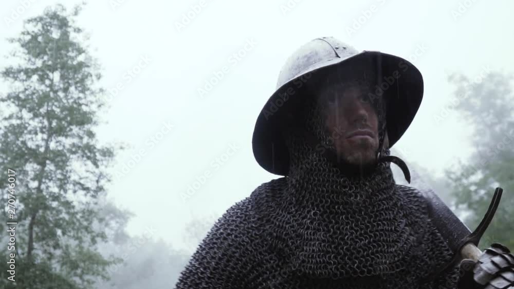 Medieval soldier in metal armor is fighting with his sword Stock Video ...