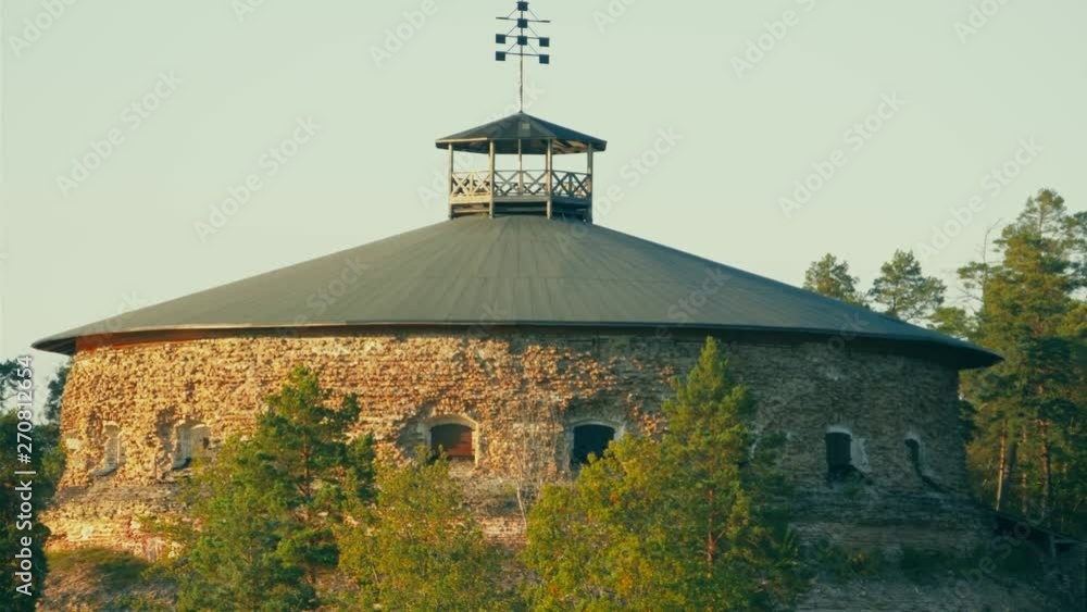 Moving away from an old round building from the middle ages that could ...