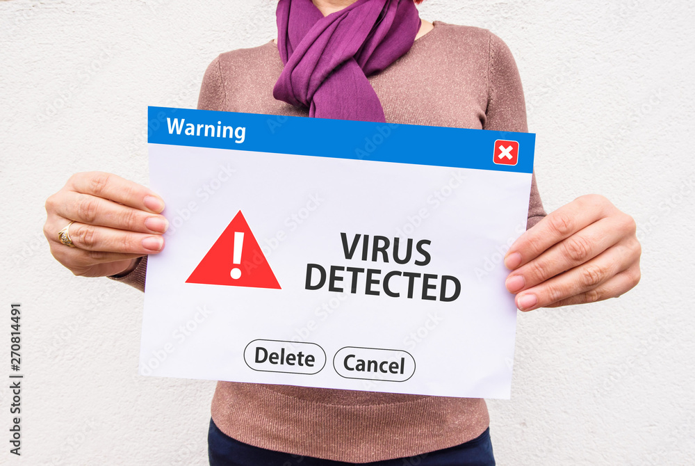 woman hands holds paper sheet with VIRUS DETECTED words and warning ...