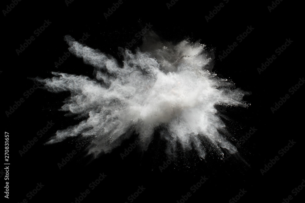 White powder explosion.Freeze motion of white dust particles on black ...