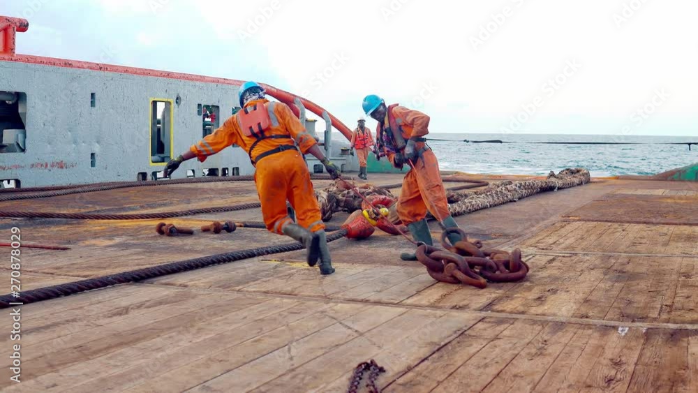 Anchor-handling Tug Supply AHTS vessel crew preparing vessel for static ...